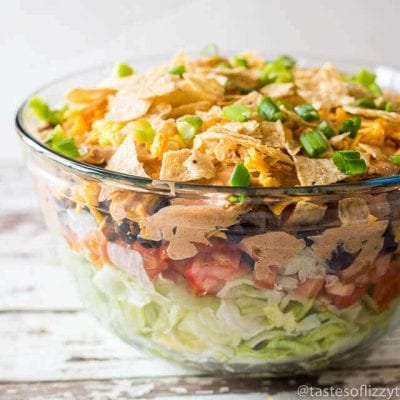 Mexican Salad {An Easy Layered Recipe with Beef, Beans and a Special Sauce}