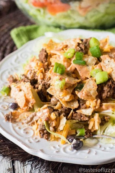 Mexican Salad {An Easy Layered Recipe with Beef, Beans and a Special Sauce}