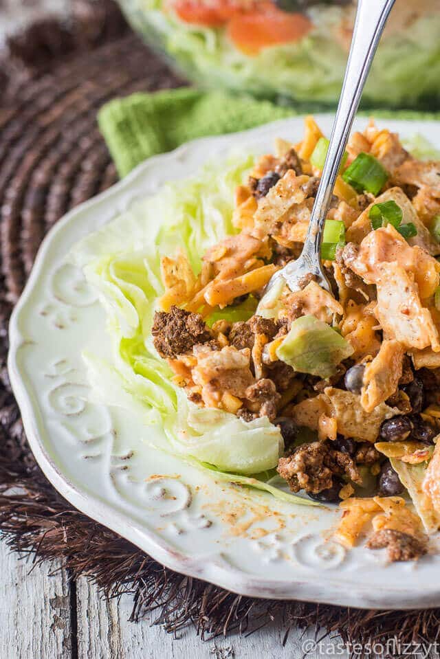 Mexican Salad {An Easy Layered Recipe with Beef, Beans and a Special Sauce}